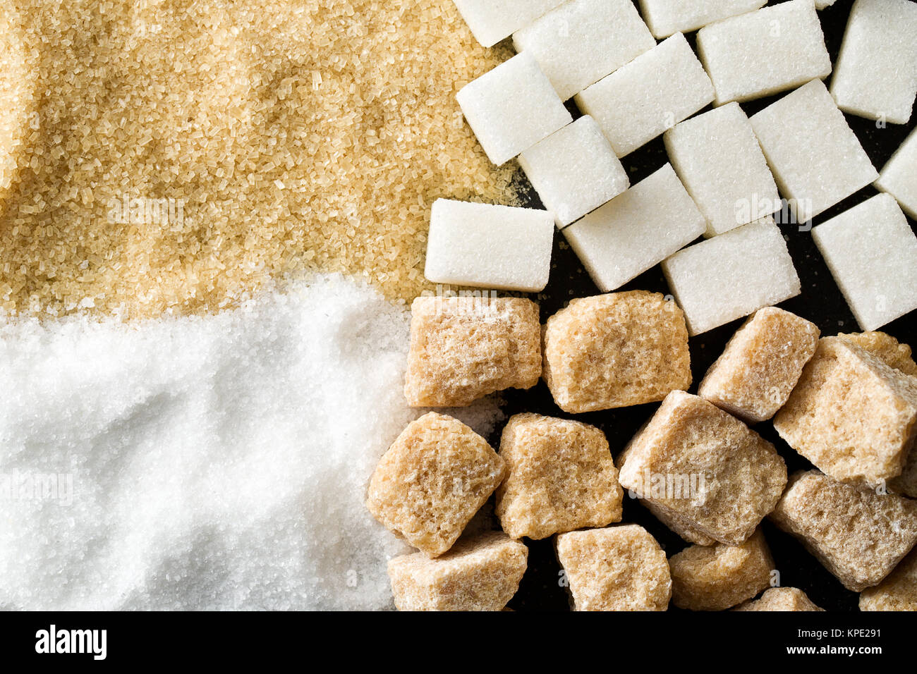 unrefined cane and white sugar Stock Photo - Alamy