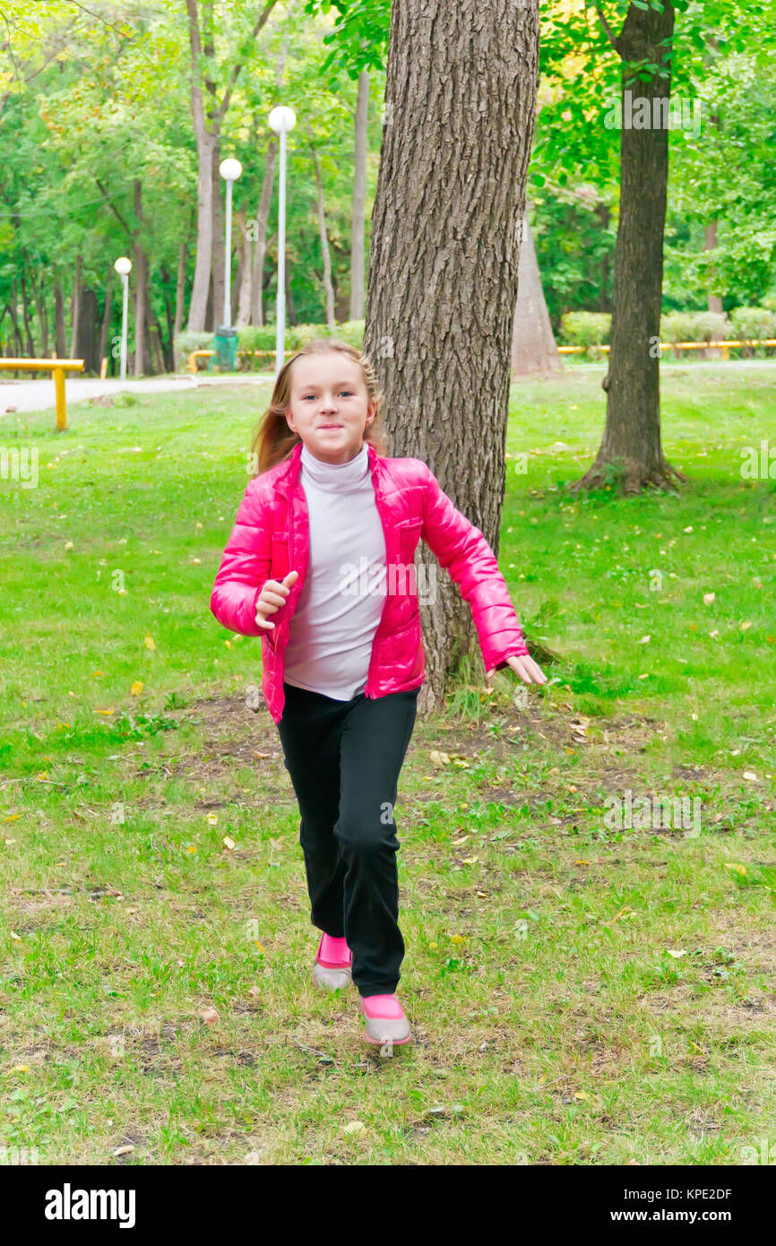 Cute running girl Stock Photo - Alamy