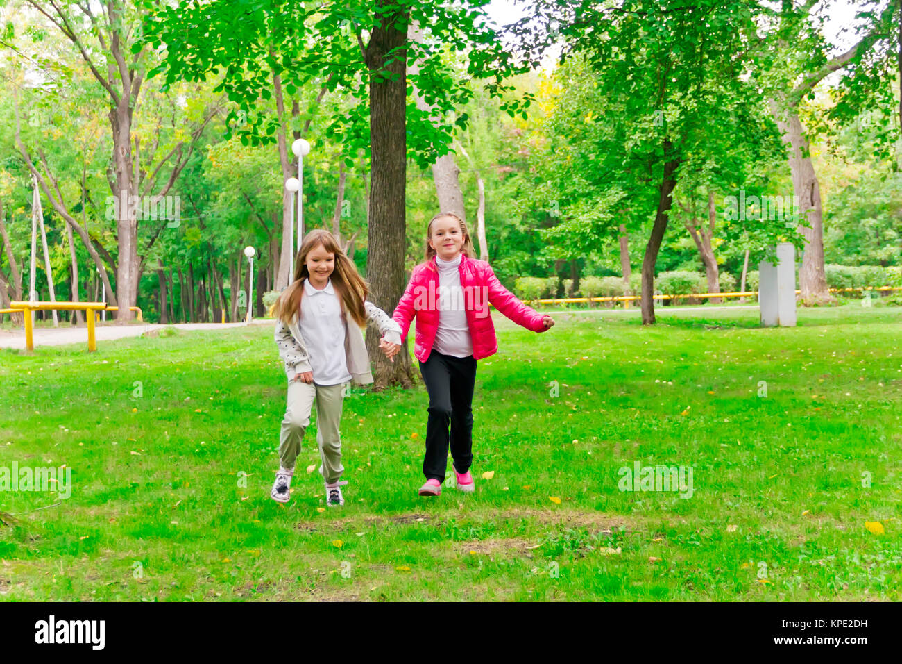 Cute two running girls Stock Photo - Alamy