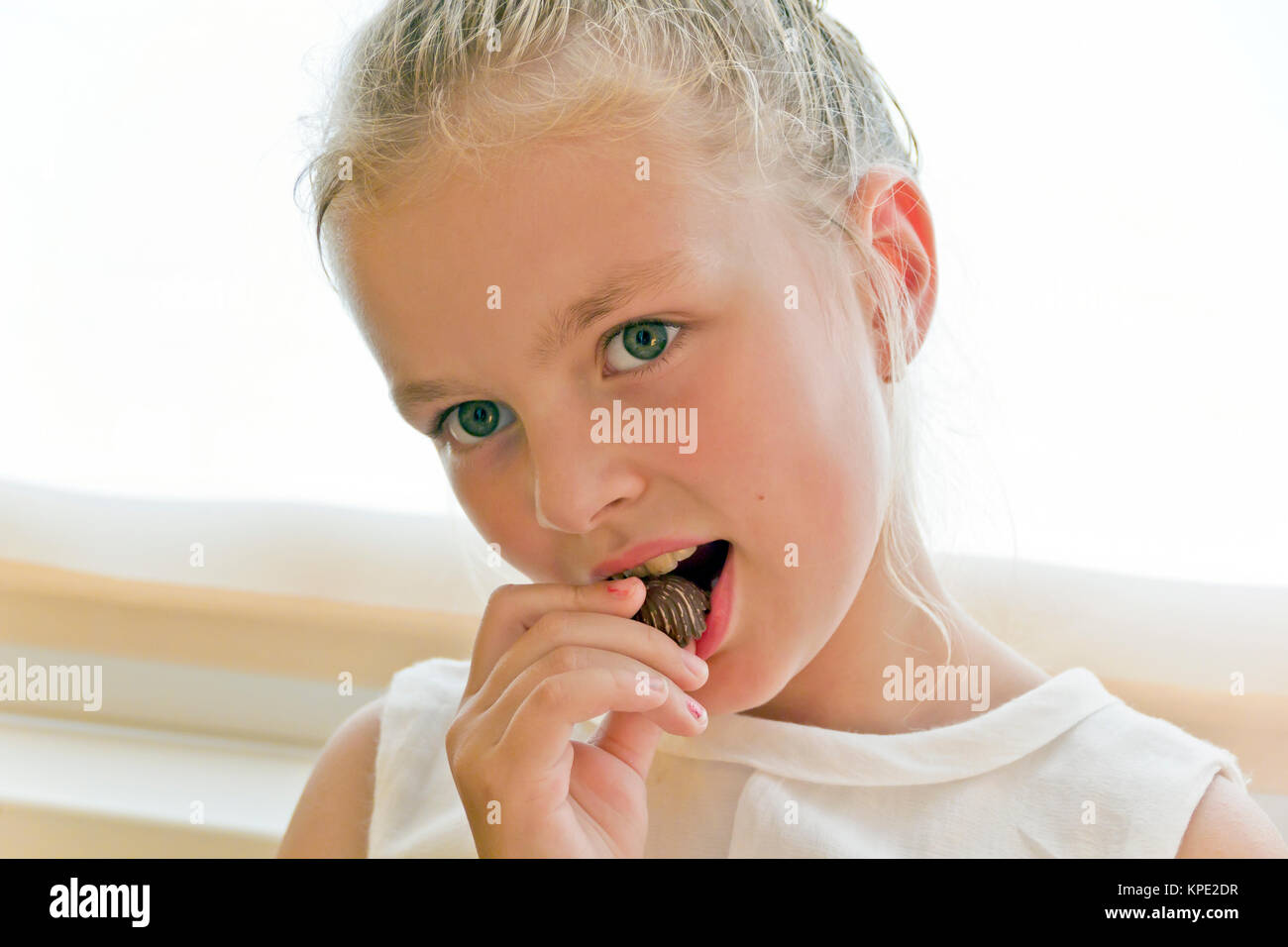 Eating cute girl Stock Photo - Alamy
