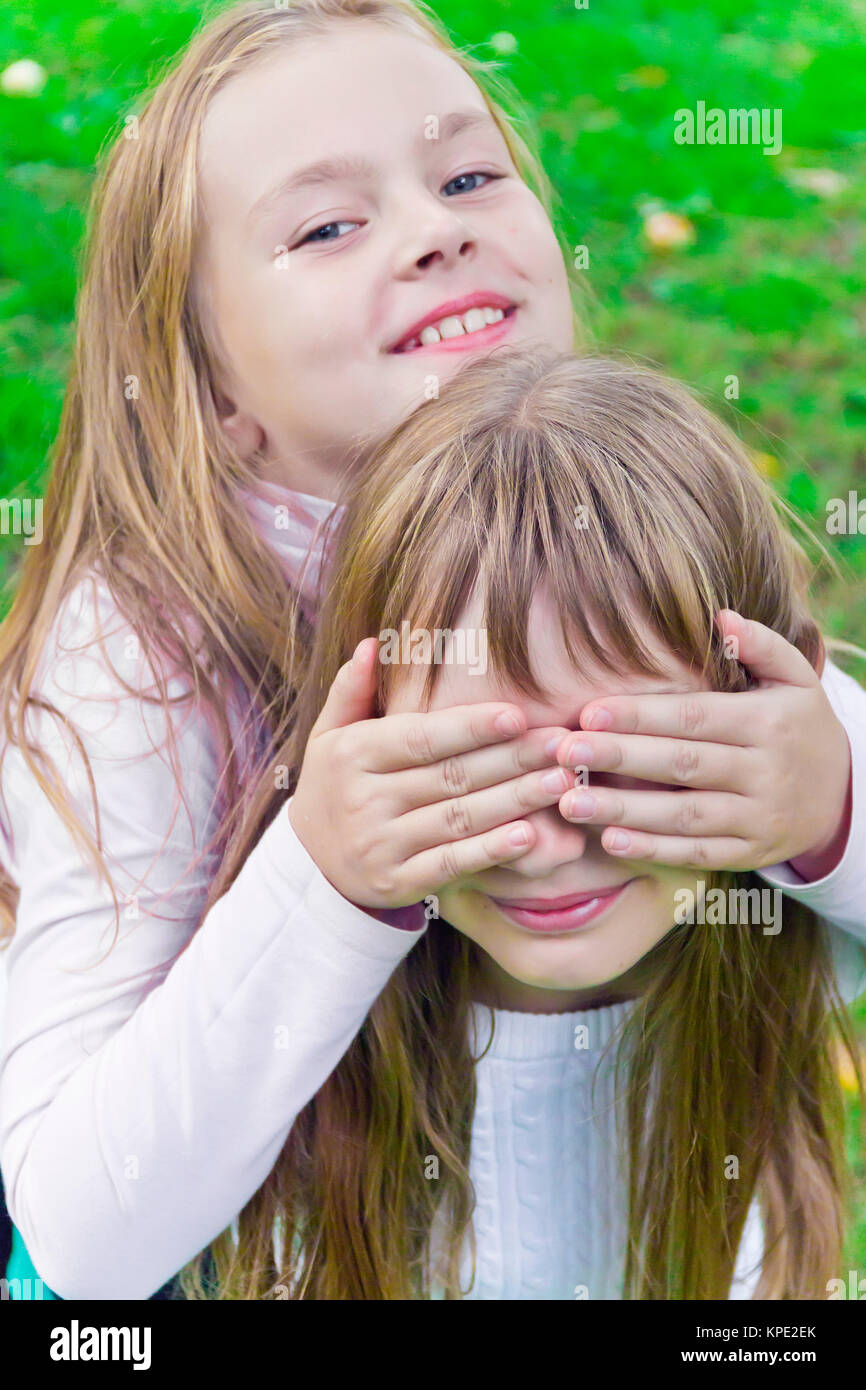 Cute two playing girls Stock Photo - Alamy
