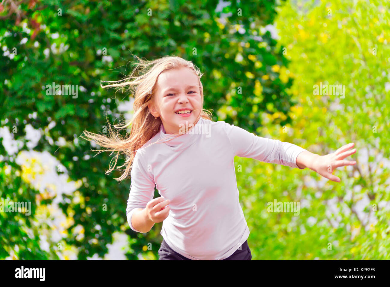 Cute running girl Stock Photo - Alamy