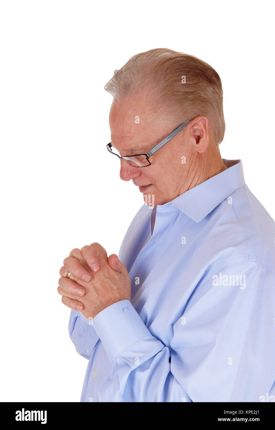 Folded hands kneeling hi-res stock photography and images - Alamy