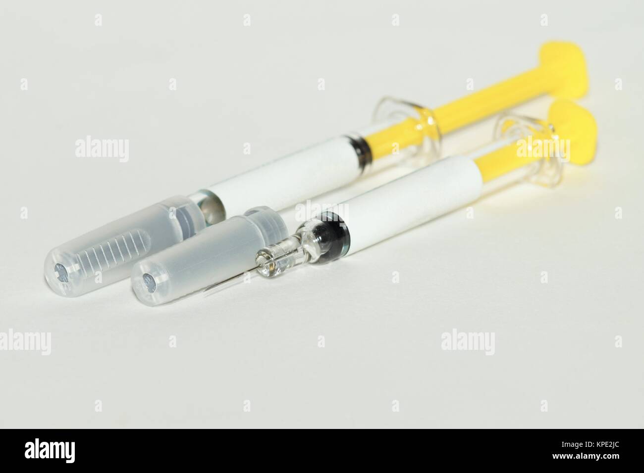 syringes on white background Stock Photo - Alamy