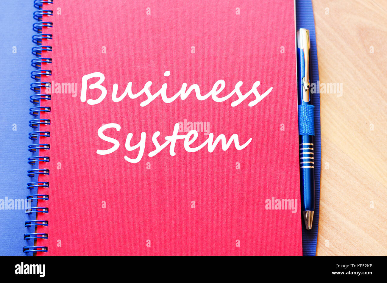 Business system write on notebook Stock Photo - Alamy