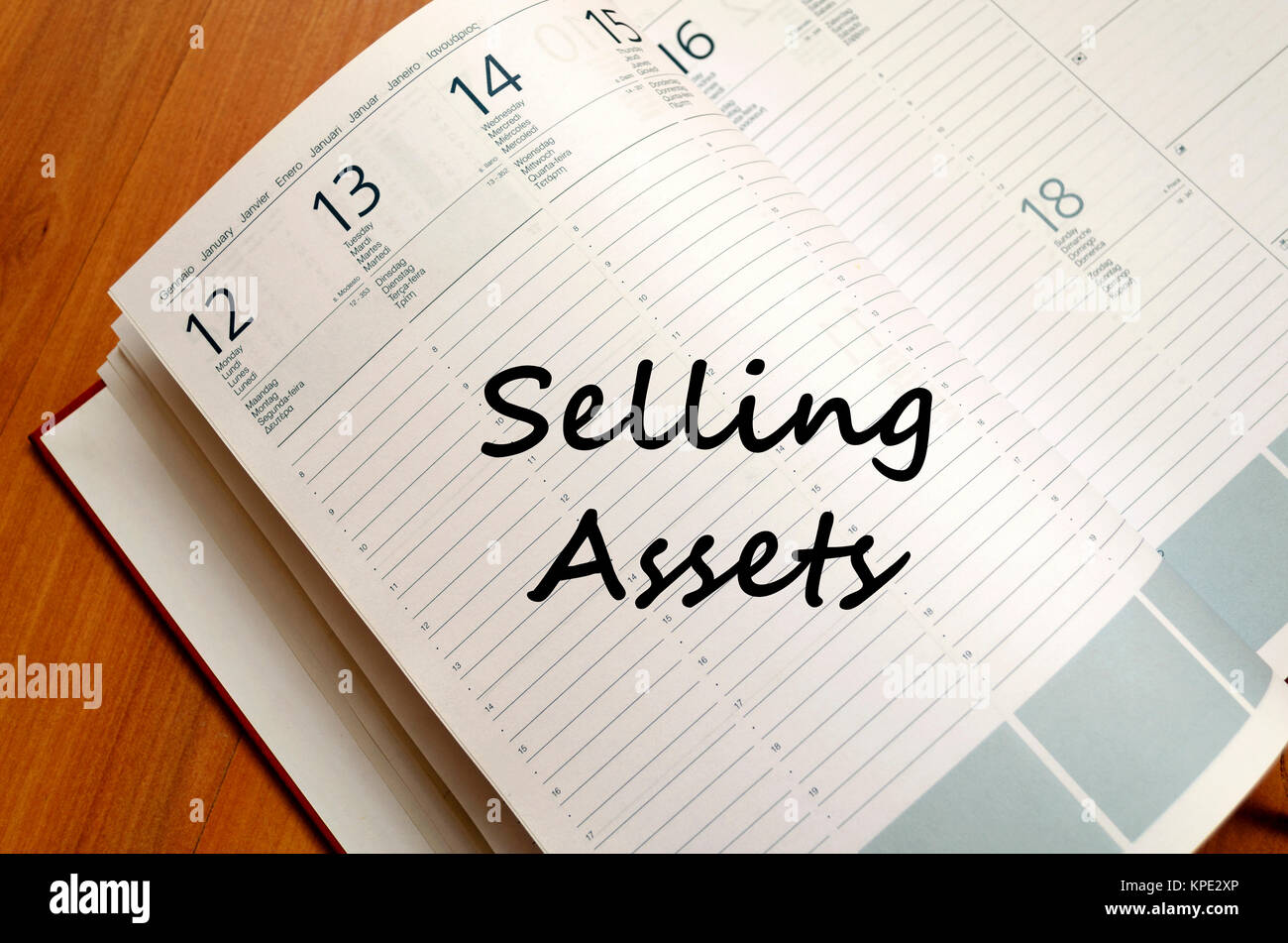 Selling assets write on notebook Stock Photo - Alamy