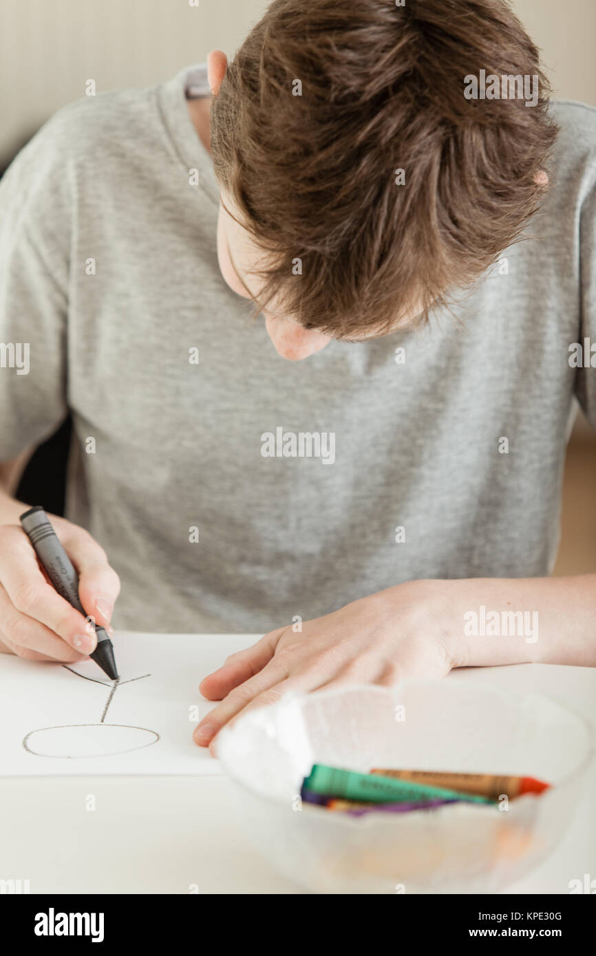 Boy coloring crayons drawing hi-res stock photography and images - Alamy