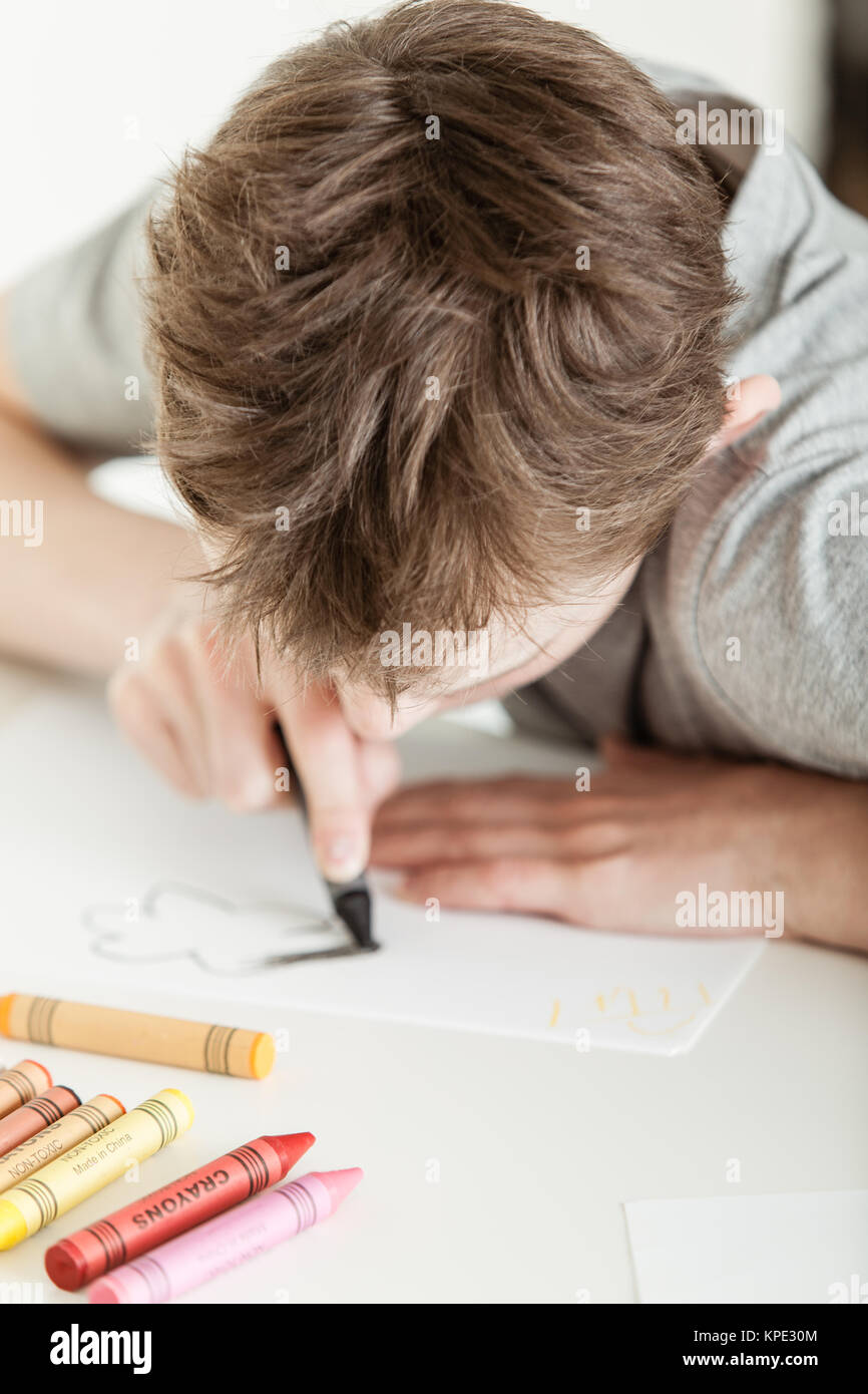 Seated drawing boy hi-res stock photography and images - Alamy