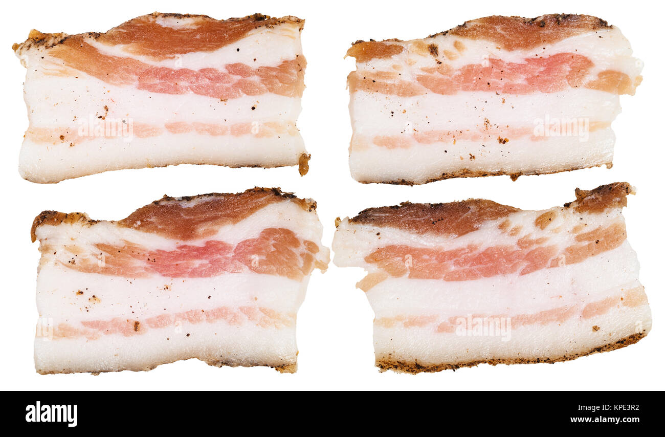 four pieces of speck isolated on white Stock Photo - Alamy