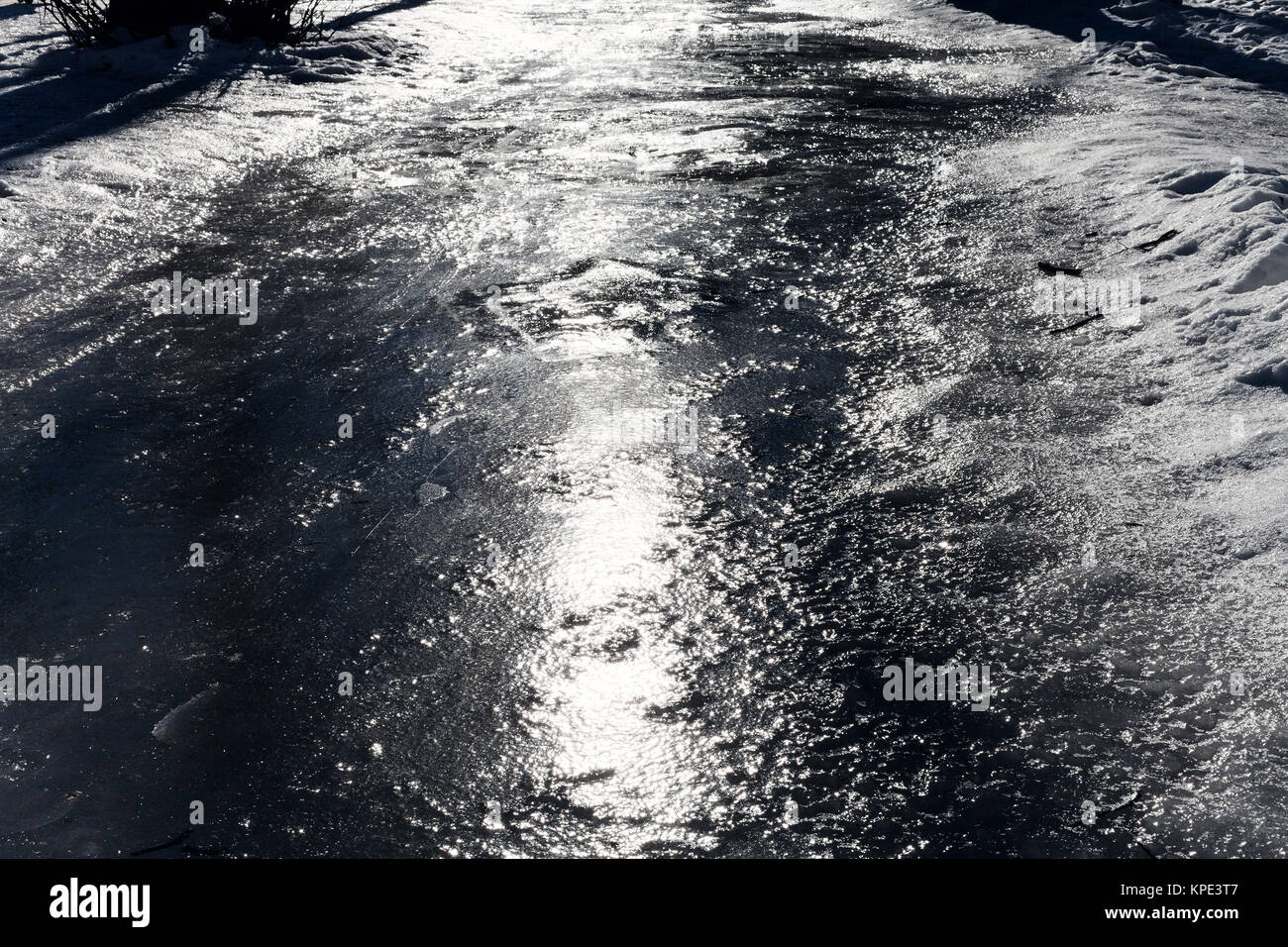 ice on frozen footpath Stock Photo - Alamy