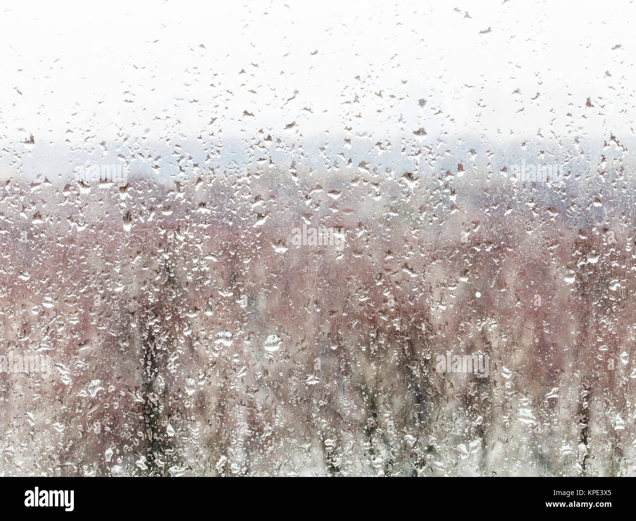 water drops from melting snow on home windowpane Stock Photo - Alamy