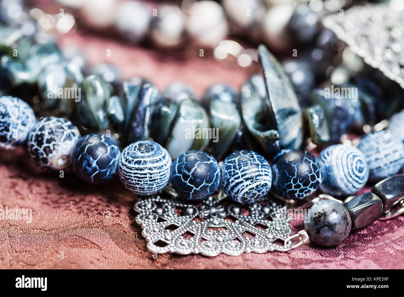 Dragon Veins Agate, shell and hematite beads Stock Photo - Alamy