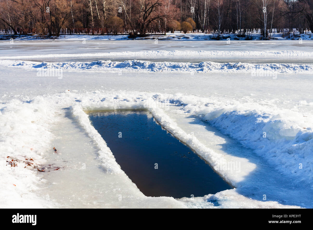 ice-hole in frozen lake Stock Photo - Alamy