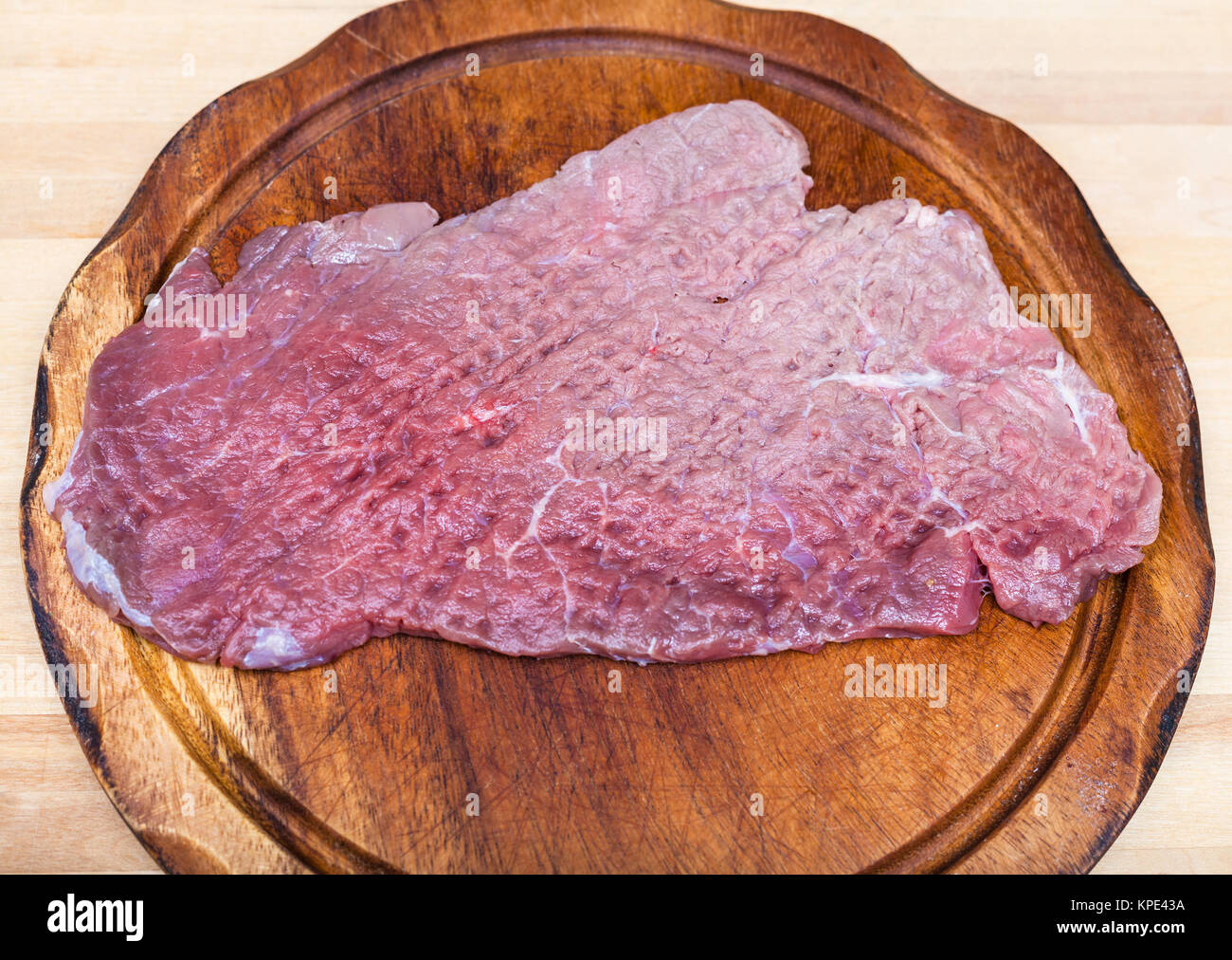 top view of beaten piece of meat Stock Photo - Alamy
