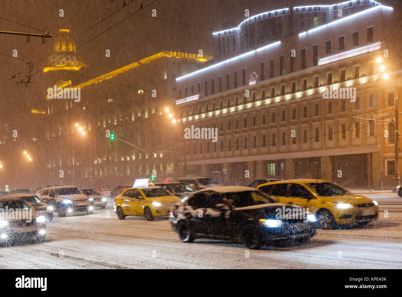 street traffic under snow in night city Stock Photo - Alamy
