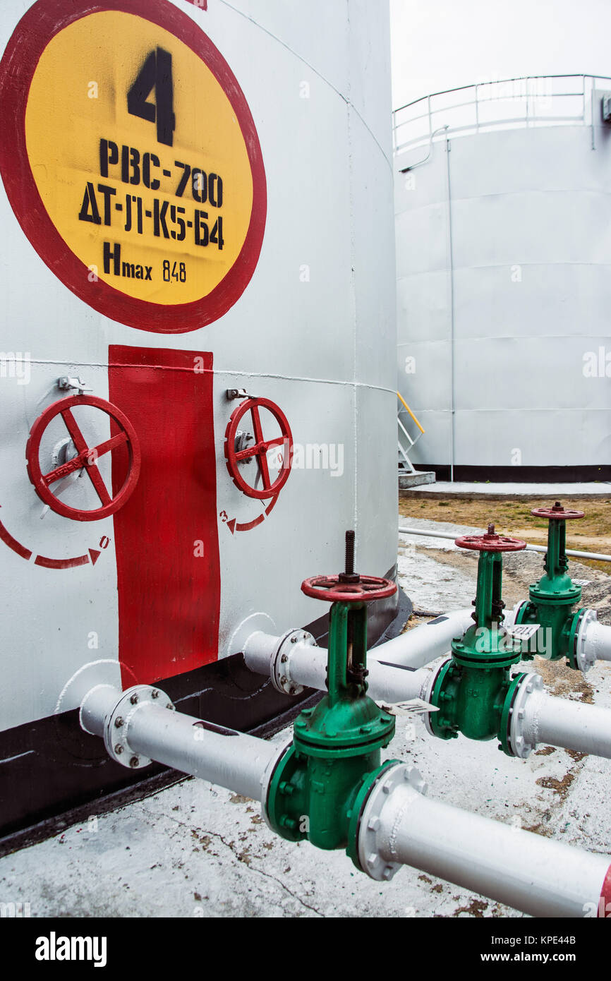 Gate valves at the storage tank number four Stock Photo - Alamy