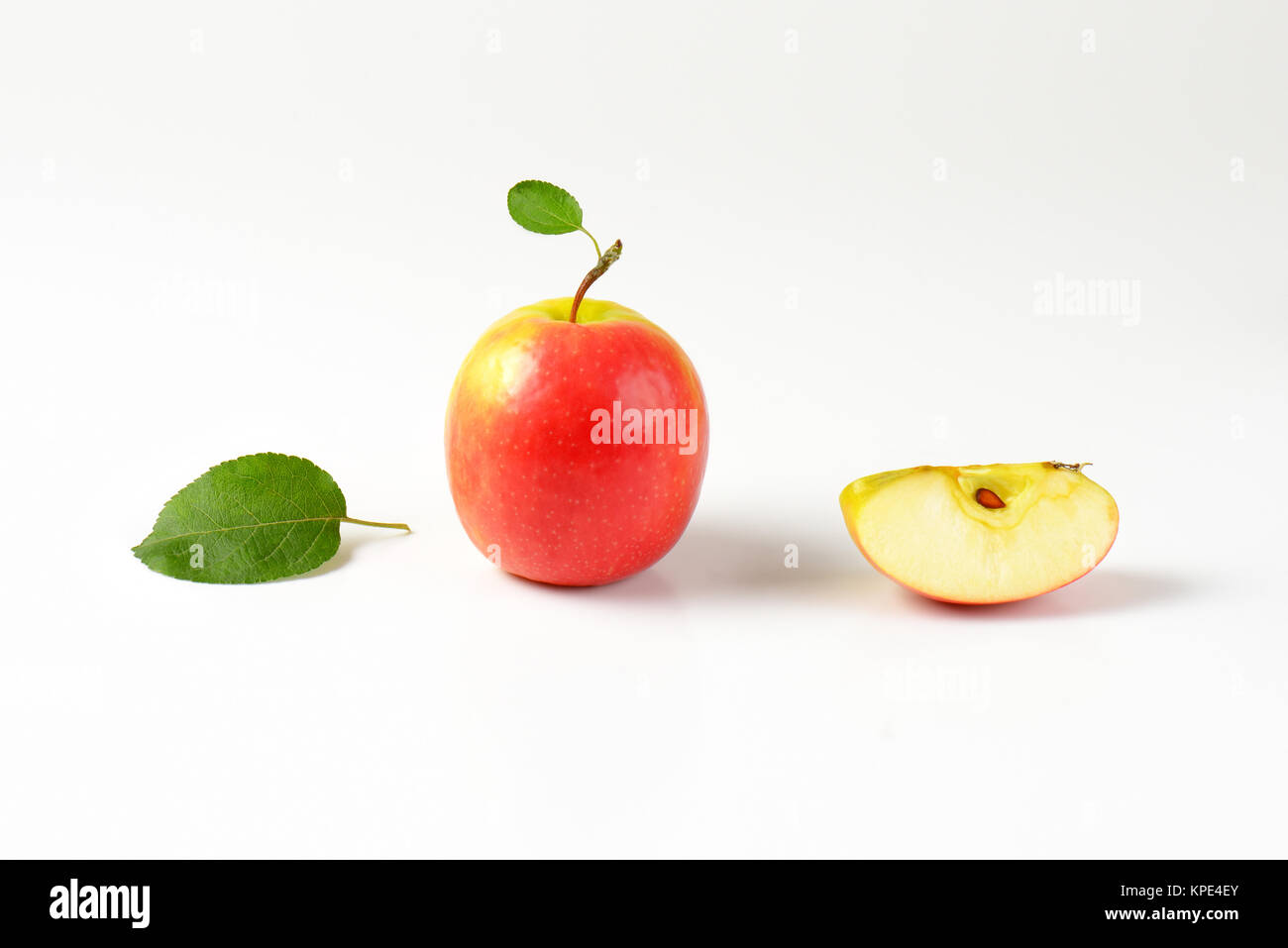 one whole apple and a quarter Stock Photo - Alamy