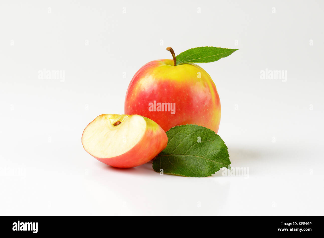 one whole apple and a quarter Stock Photo - Alamy