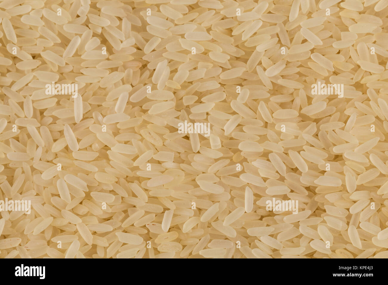 Uncooked rice background Stock Photo - Alamy
