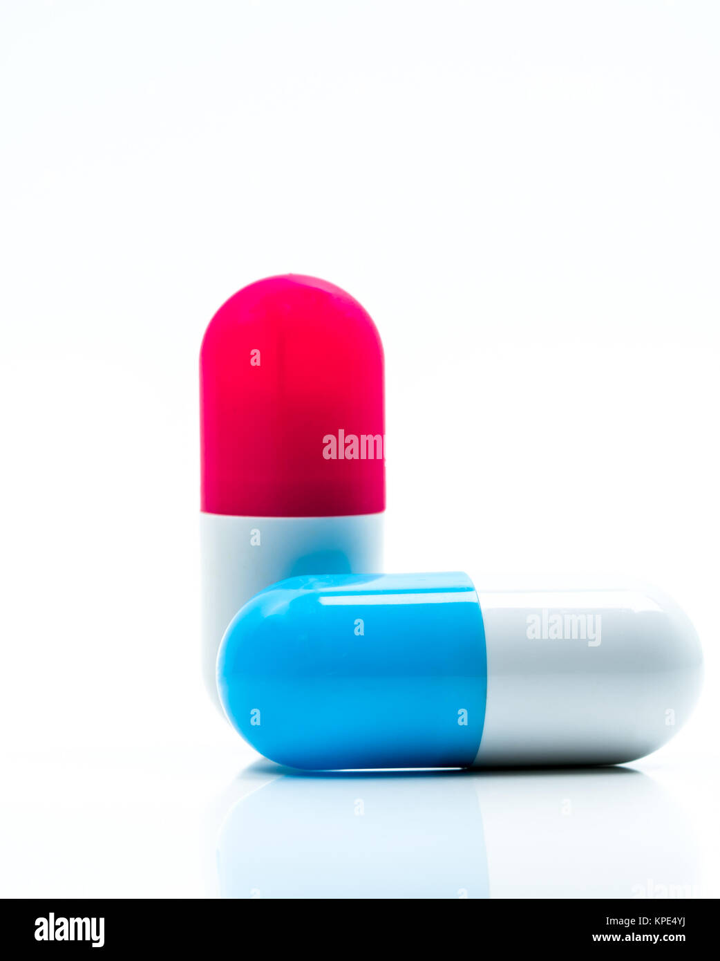 Two capsule pills isolated on white background. Global healthcare ...