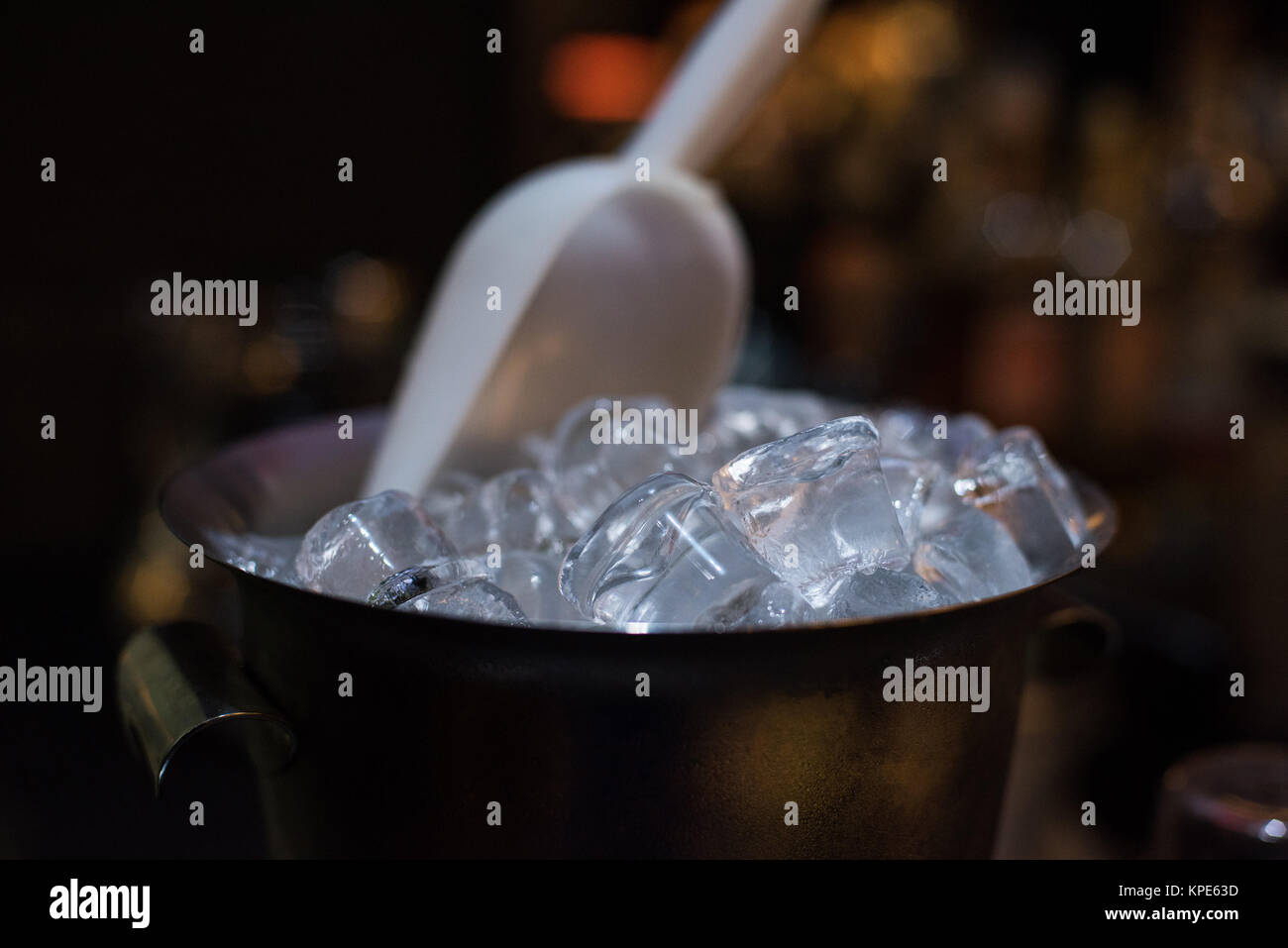 Ice bucket with ice cubes Stock Photo - Alamy