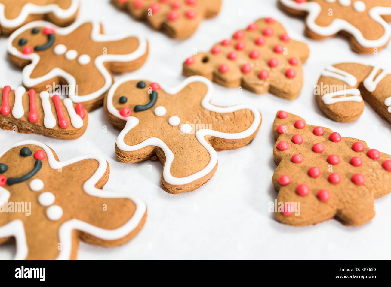 Decorating traditional gingerbread cookies with royal icing for ...