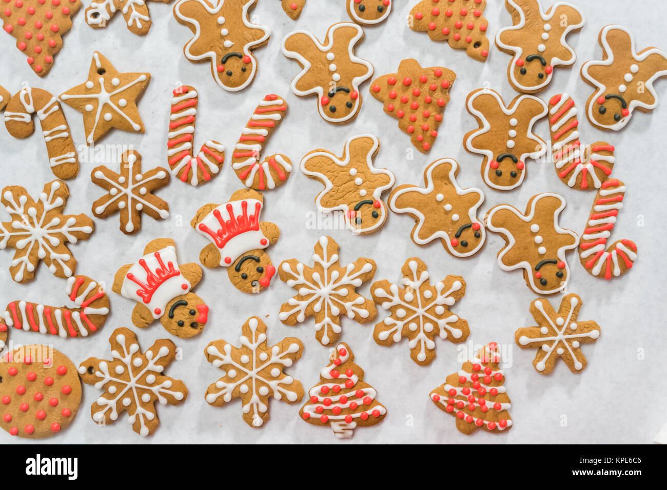 Decorating traditional gingerbread cookies with royal icing for ...