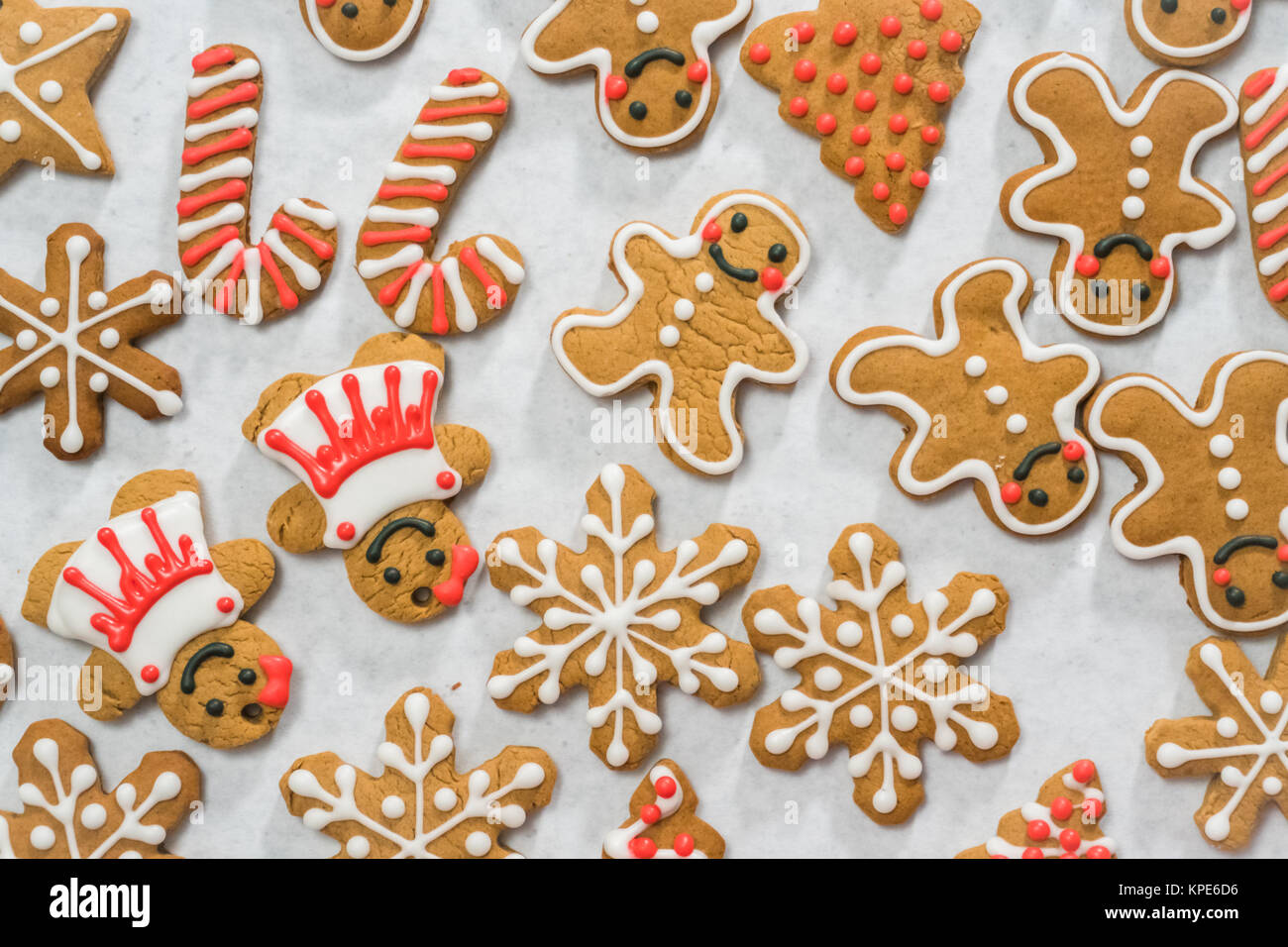 Decorating traditional gingerbread cookies with royal icing for ...