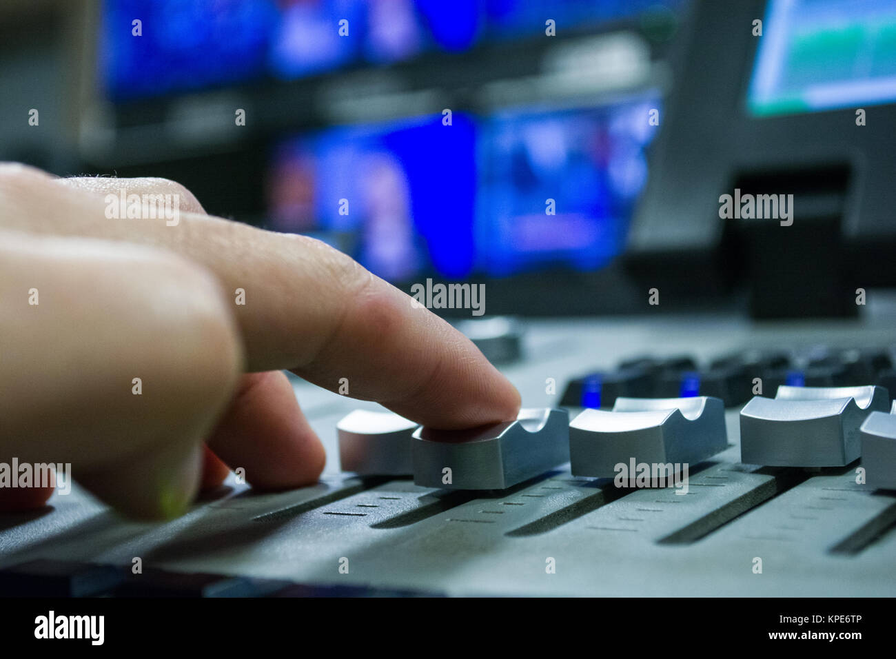 hand on a light, mixing desk fader in blur television gallery Stock ...