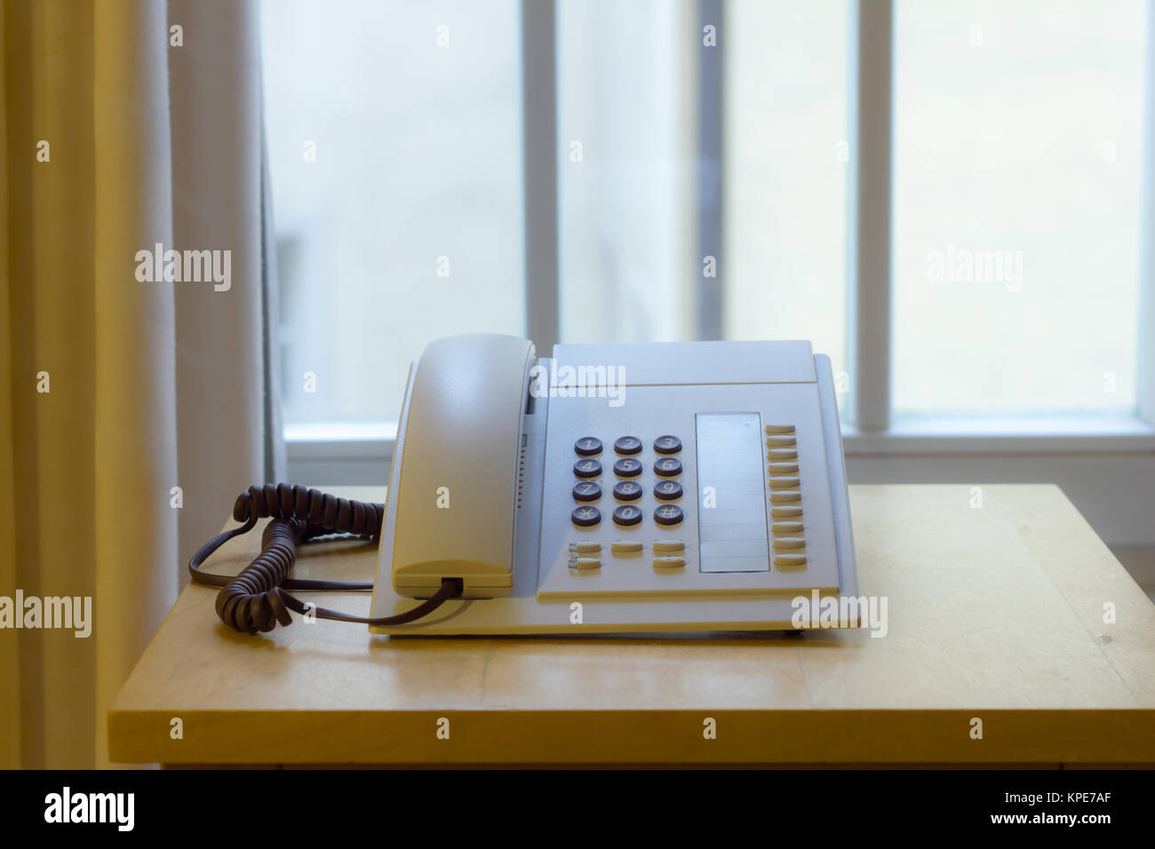 Telephone in an office window Stock Photo - Alamy