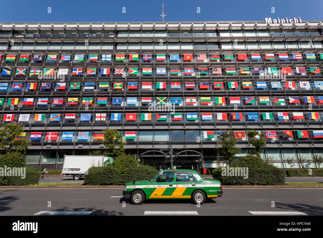 Offices of the Mainichi Newspaper Company display all 206 flags of the ...