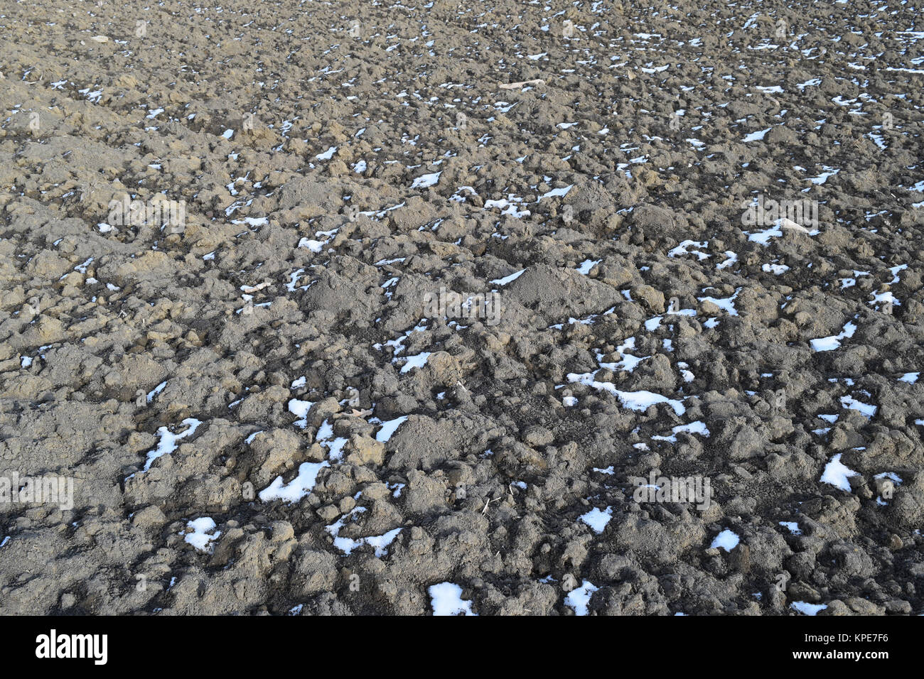 Melting snow on plowed soil Stock Photo - Alamy