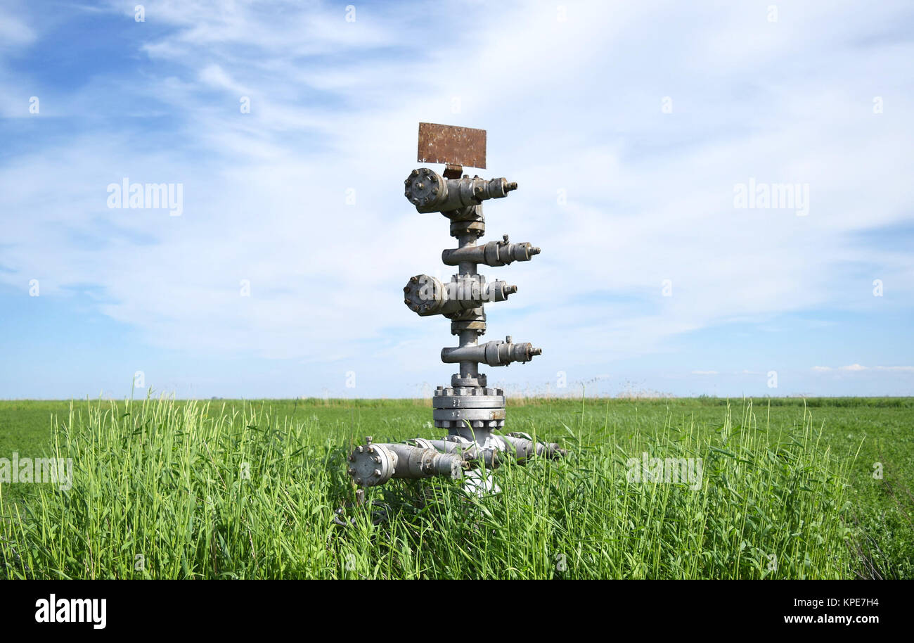 Canned oil well against the sky and field Stock Photo - Alamy