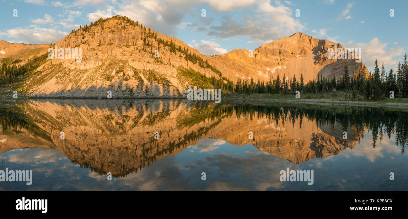Pentagon Mountain and Dean Lake at sunrise in the Bob Marshall Wilderness, Montana Stock Photo ...