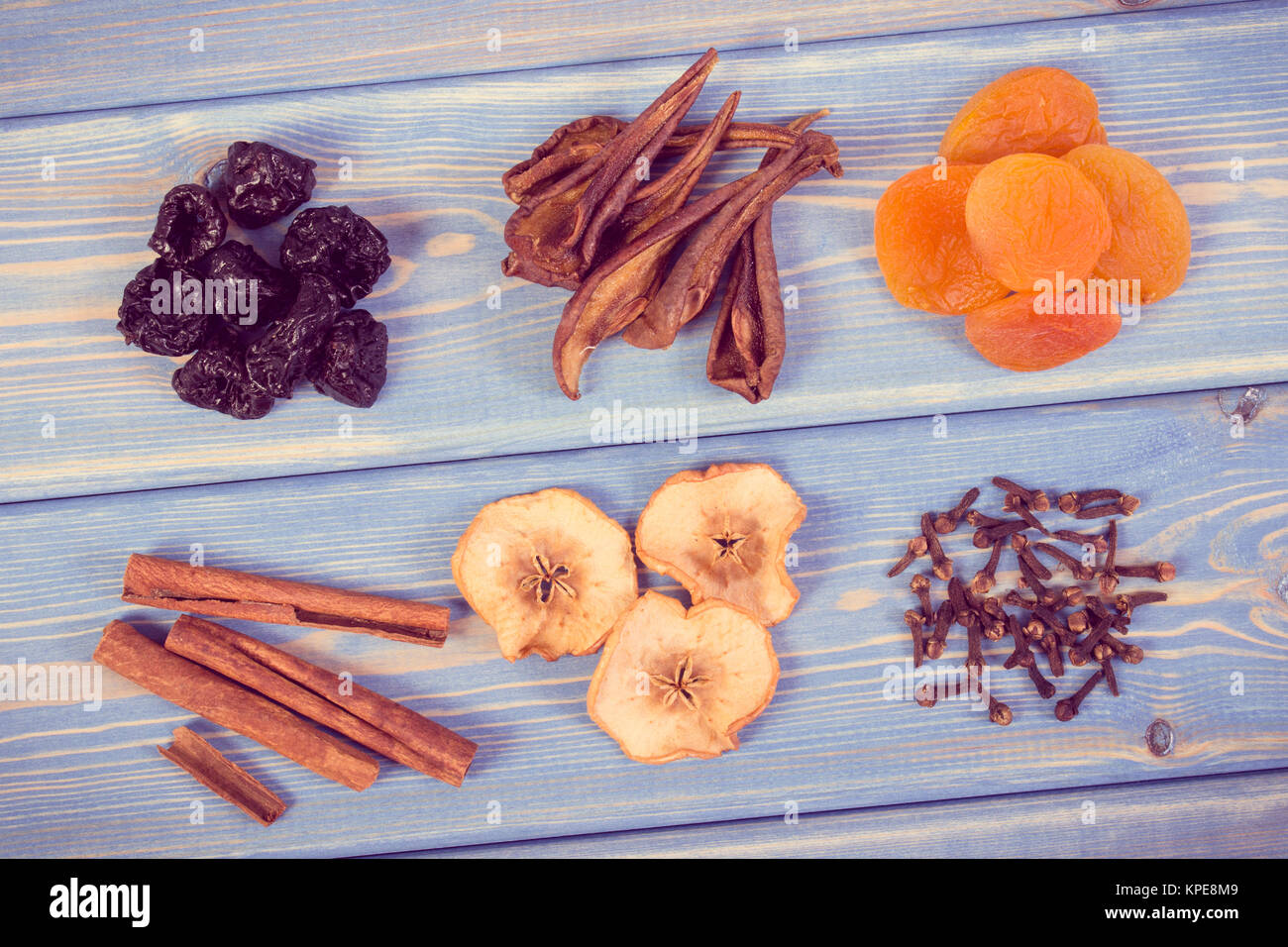 Vintage photo, Dried ingredients and spices for preparing compote of ...