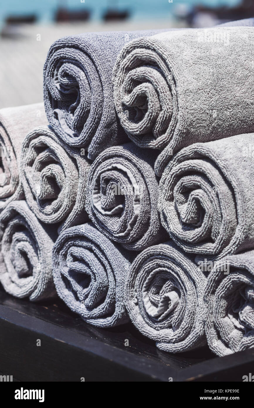 Stack of rolled towels in hotel near beach Stock Photo - Alamy
