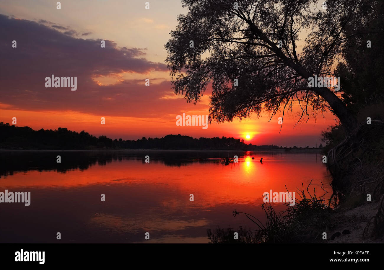 Sunset over the river Stock Photo - Alamy