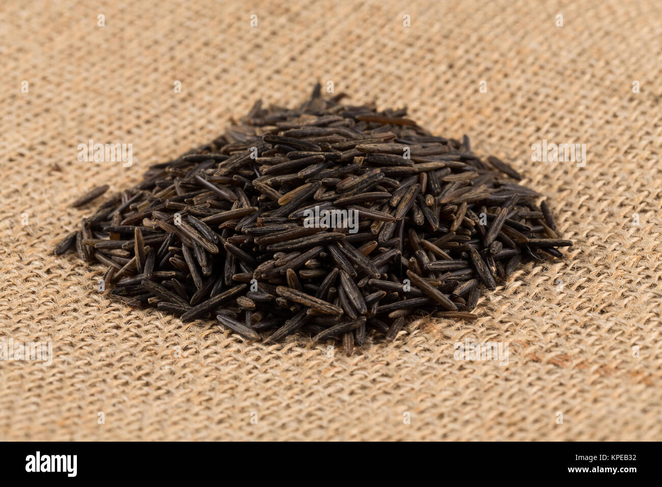 Heap of wild rice on white background Stock Photo - Alamy