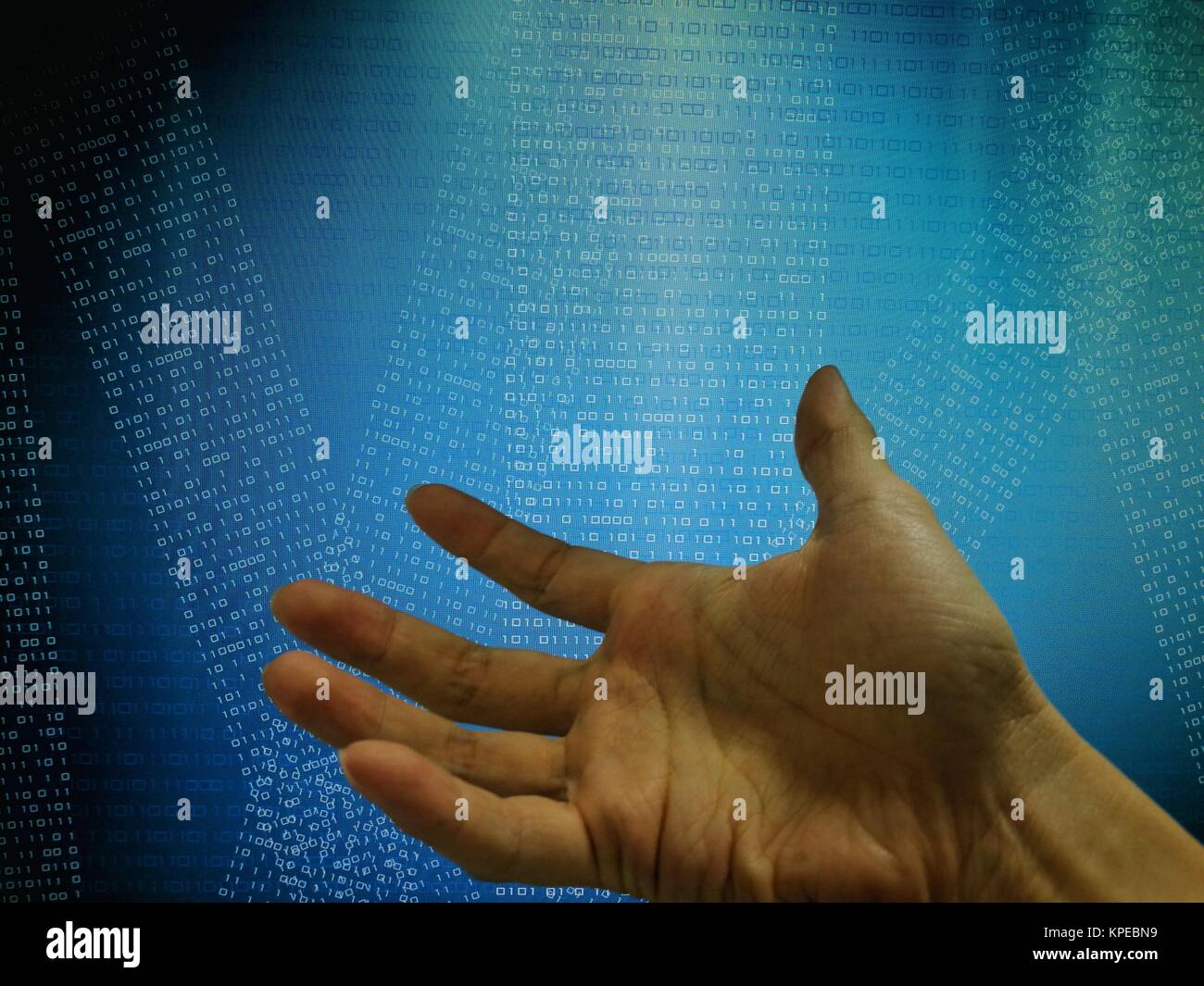 Hand in front of coding on computer screen display. Blue binary code background Stock Photo - Alamy