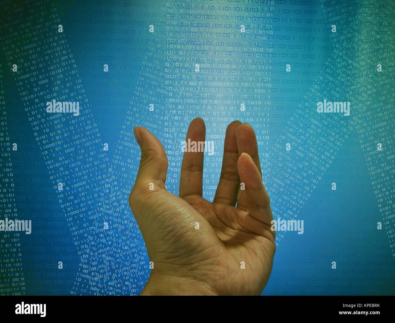 Hand in front of coding on computer screen display. Blue binary code background Stock Photo - Alamy