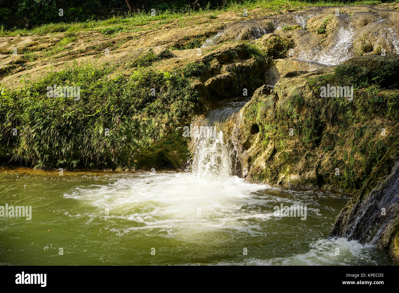 Small Waterfall by the Lake Stock Photo - Alamy