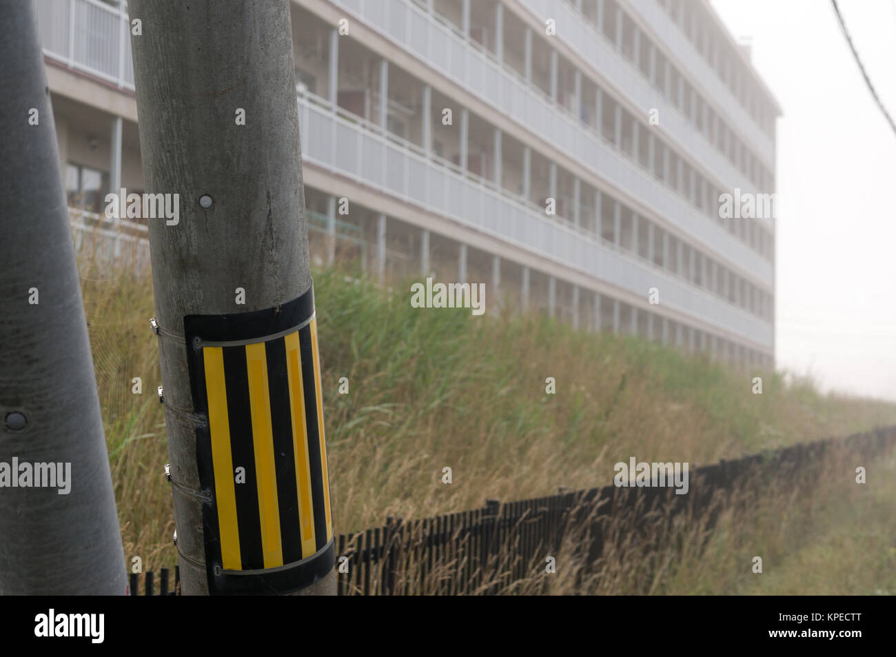 Warning sign on telephone wire pole Stock Photo - Alamy