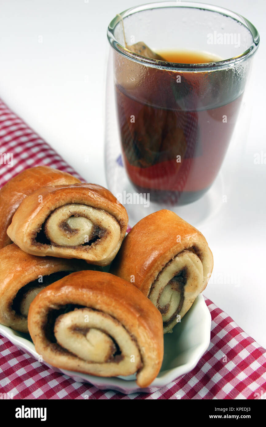 cinnamon rolls with tea Stock Photo - Alamy