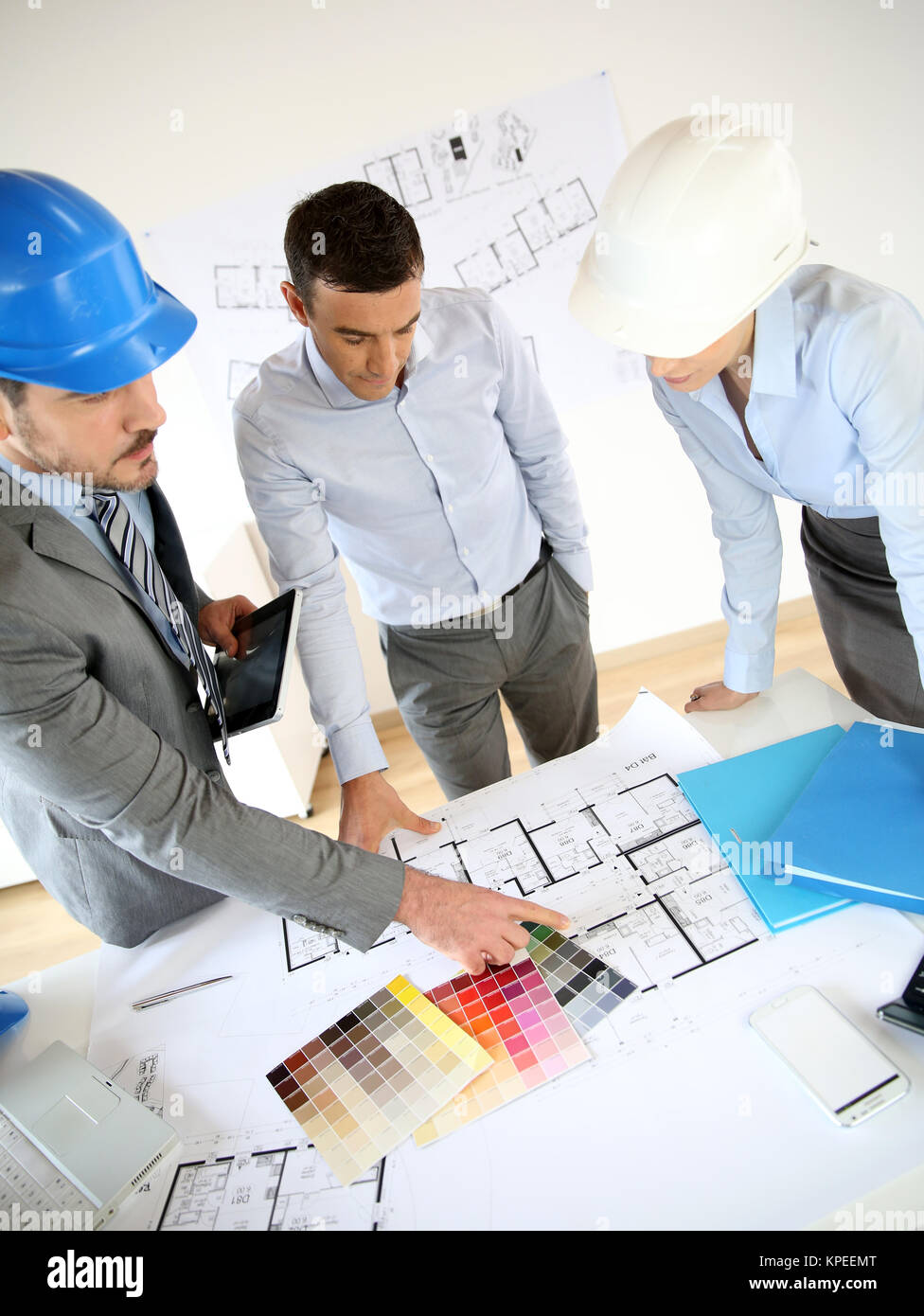 Team of architects presenting construction project Stock Photo - Alamy
