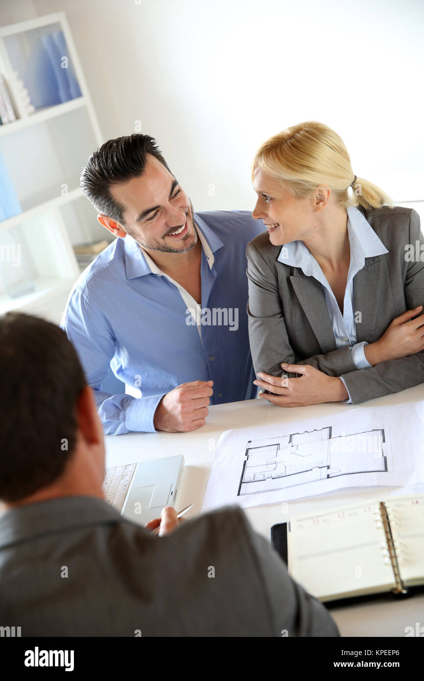 Couple meeting real-estate agent to buy property Stock Photo - Alamy