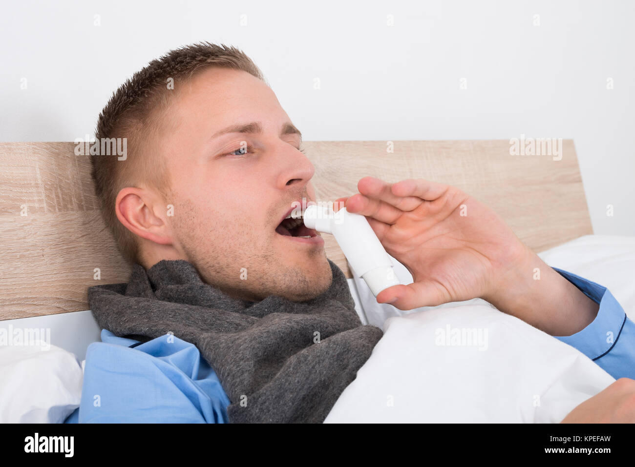 Close-up Of Man Using Asthma Inhaler Stock Photo - Alamy