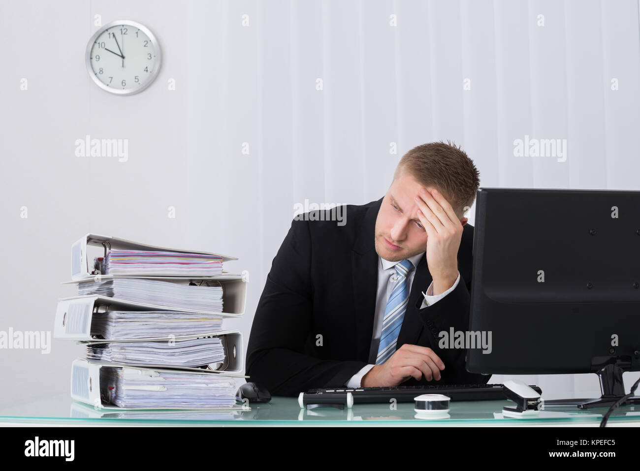 Stressed Businessman Sitting In Office Stock Photo - Alamy