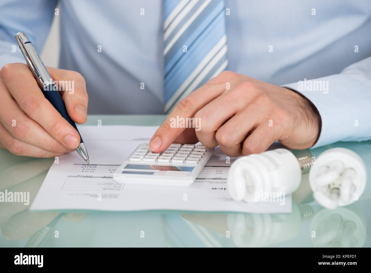 Businessman using calculator analyze business hi-res stock photography ...