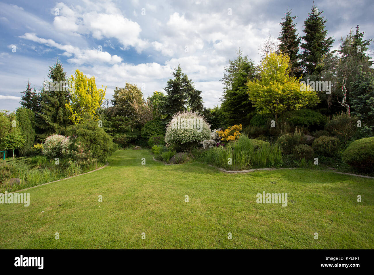 Beautiful spring garden design Stock Photo - Alamy