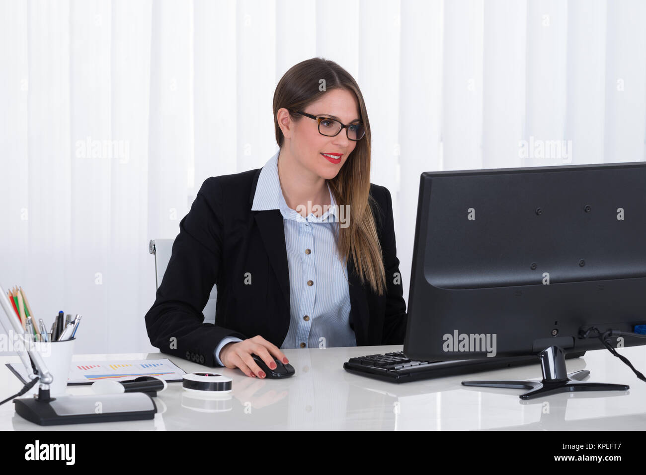 Businesswoman Using Computer Stock Photo - Alamy